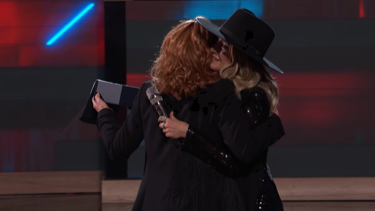 Reba McEntire surprises Lainey Wilson with an invitation to join the Grand Ole Opry! - Country ...